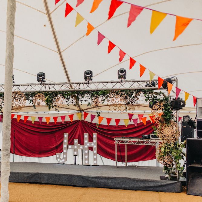 Colourful Bunting Wedding Decor for a Festival Themed Marquee Wedding